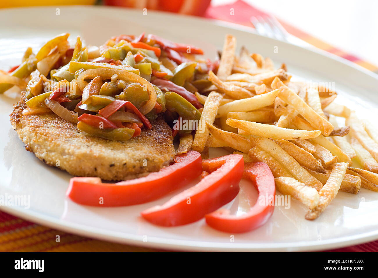gypsy schnitzel with fries Stock Photo - Alamy