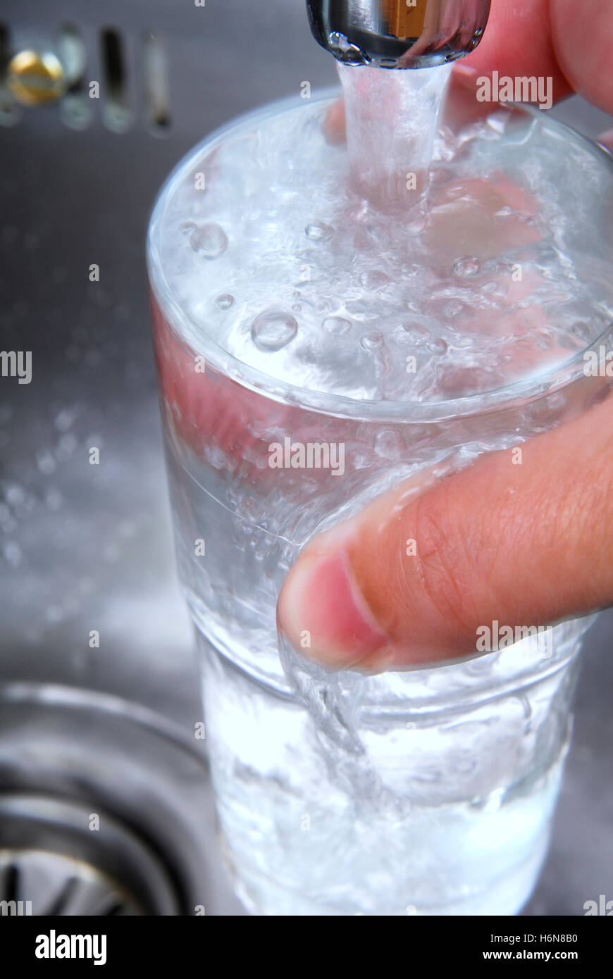 Water tap glass hand hi-res stock photography and images - Alamy