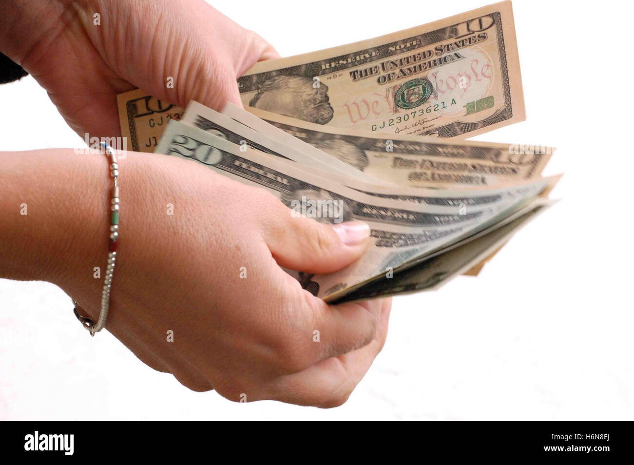 Counting dollars hand hi-res stock photography and images - Alamy