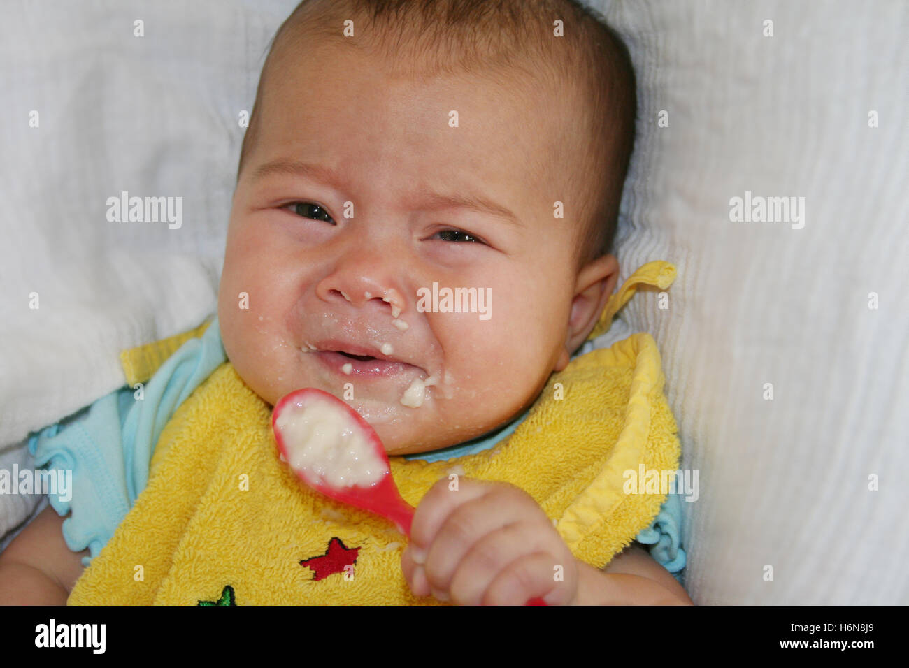 Baby dribble food hi-res stock photography and images - Alamy