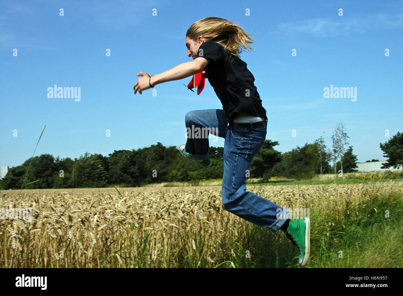 jump into the field Stock Photo - Alamy