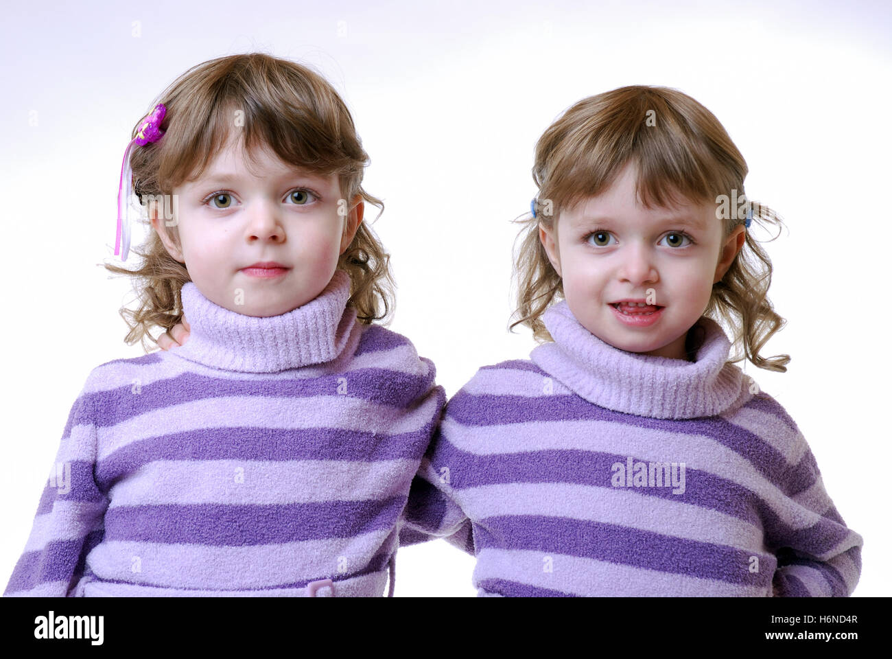 Twins embrace hi-res stock photography and images - Alamy