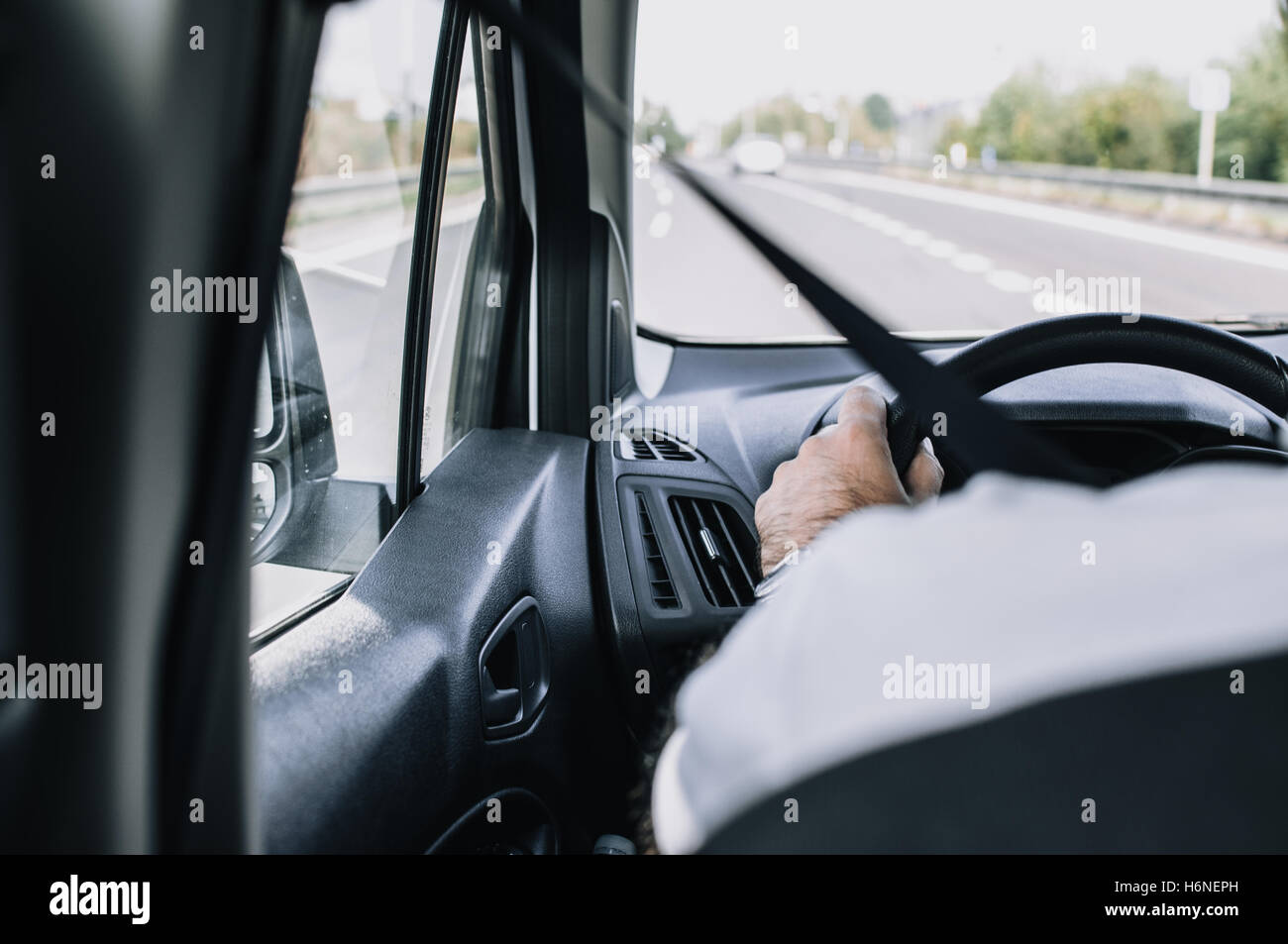 Man driving on highway Stock Photo - Alamy