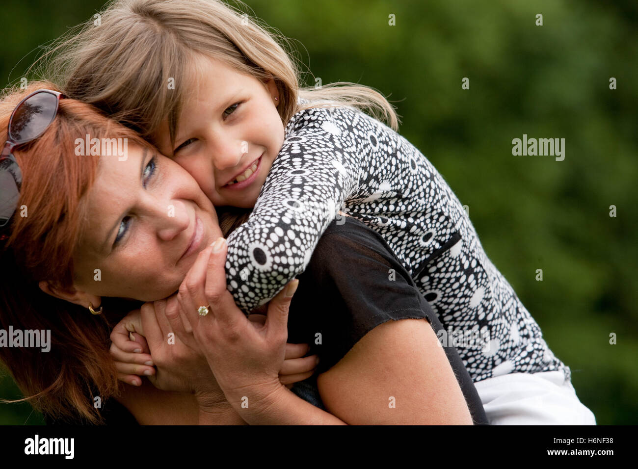 Mother hugging sweet daughter in hi-res stock photography and images ...