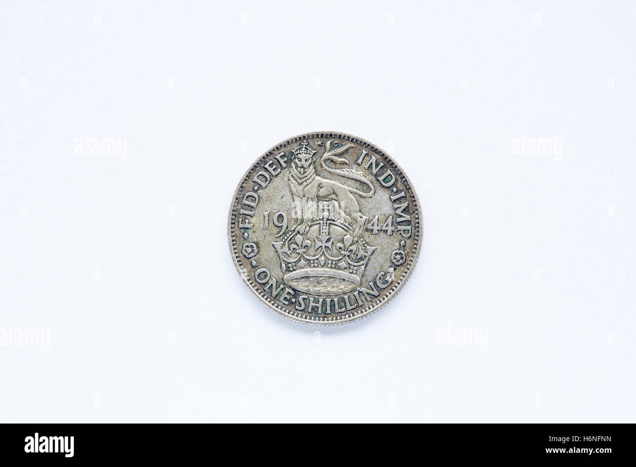 A 1944 old british one shilling coin with copy space Stock Photo - Alamy