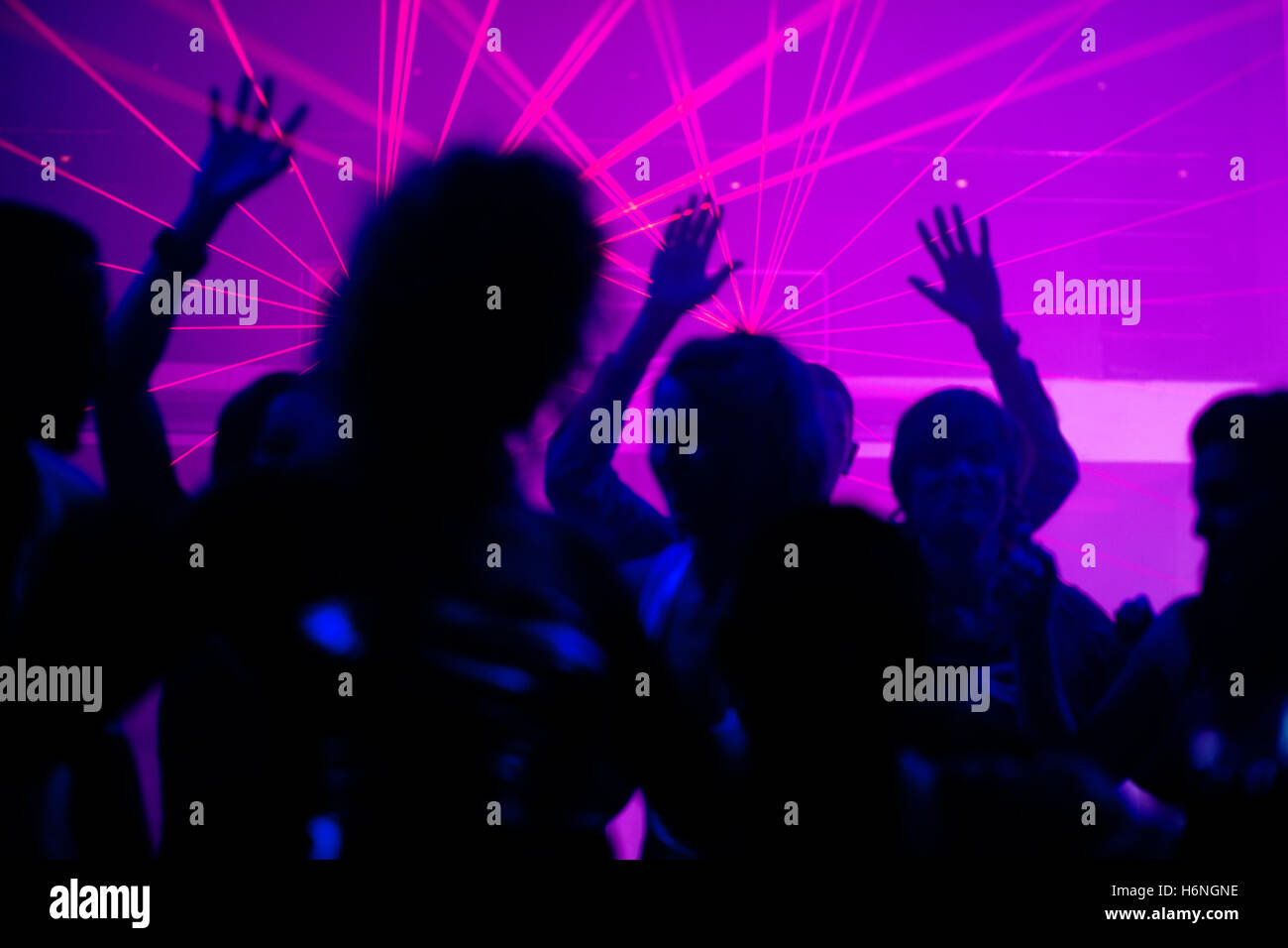 people dancing in a disco with laser Stock Photo - Alamy