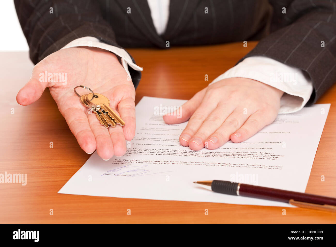 woman holding keys and rental agreement in hands Stock Photo - Alamy