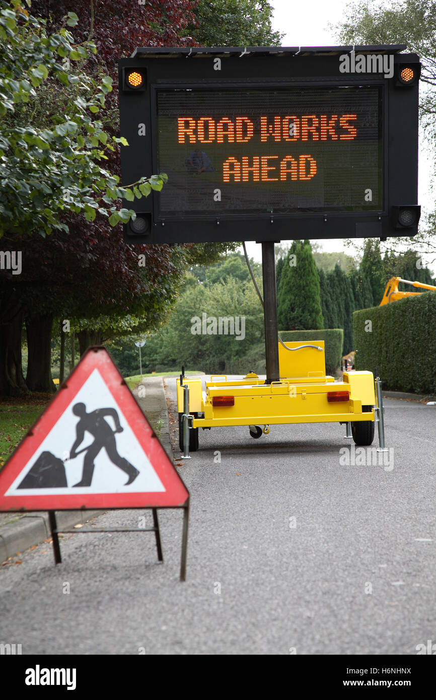 A roadside mobile, solar powered dot-matrix road sign shows the message ...