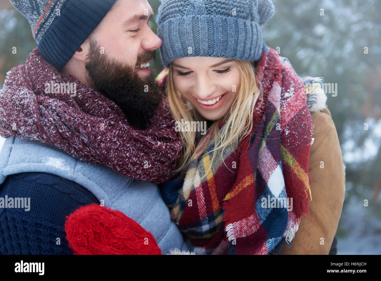 Happy couple in winter day Stock Photo - Alamy