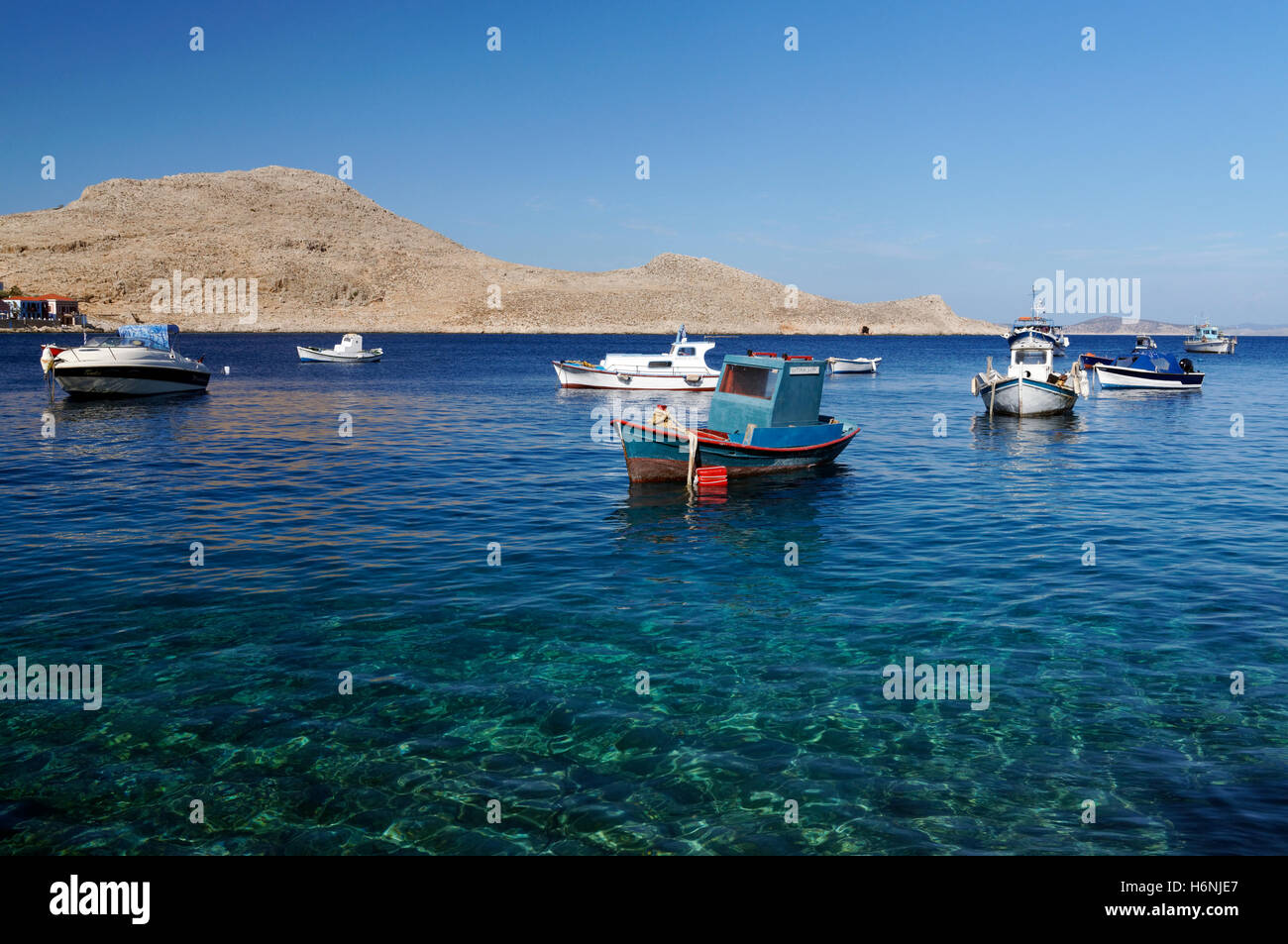 Fishing boats in harbour, Village of Emborio, Chalki Island near Rhodes ...