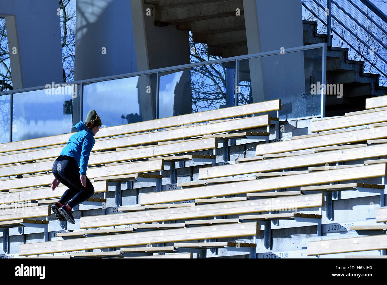 Jump training. Young woman training jumping on stairs Stock Photo - Alamy