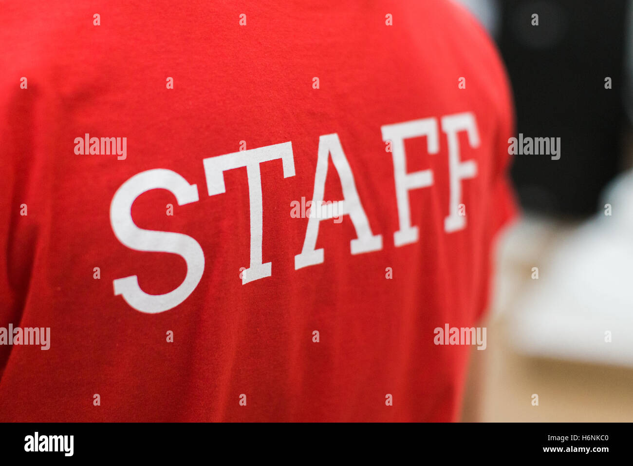 Staff volunteer helping on meeting or conference Stock Photo - Alamy