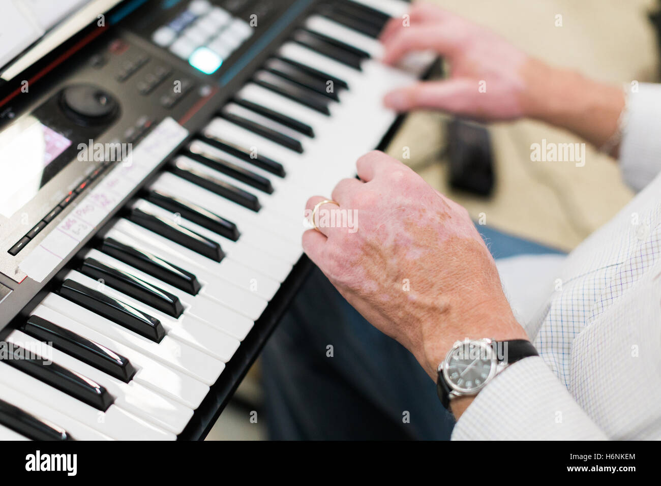 Keyboard player performing on stage live concert Stock Photo - Alamy