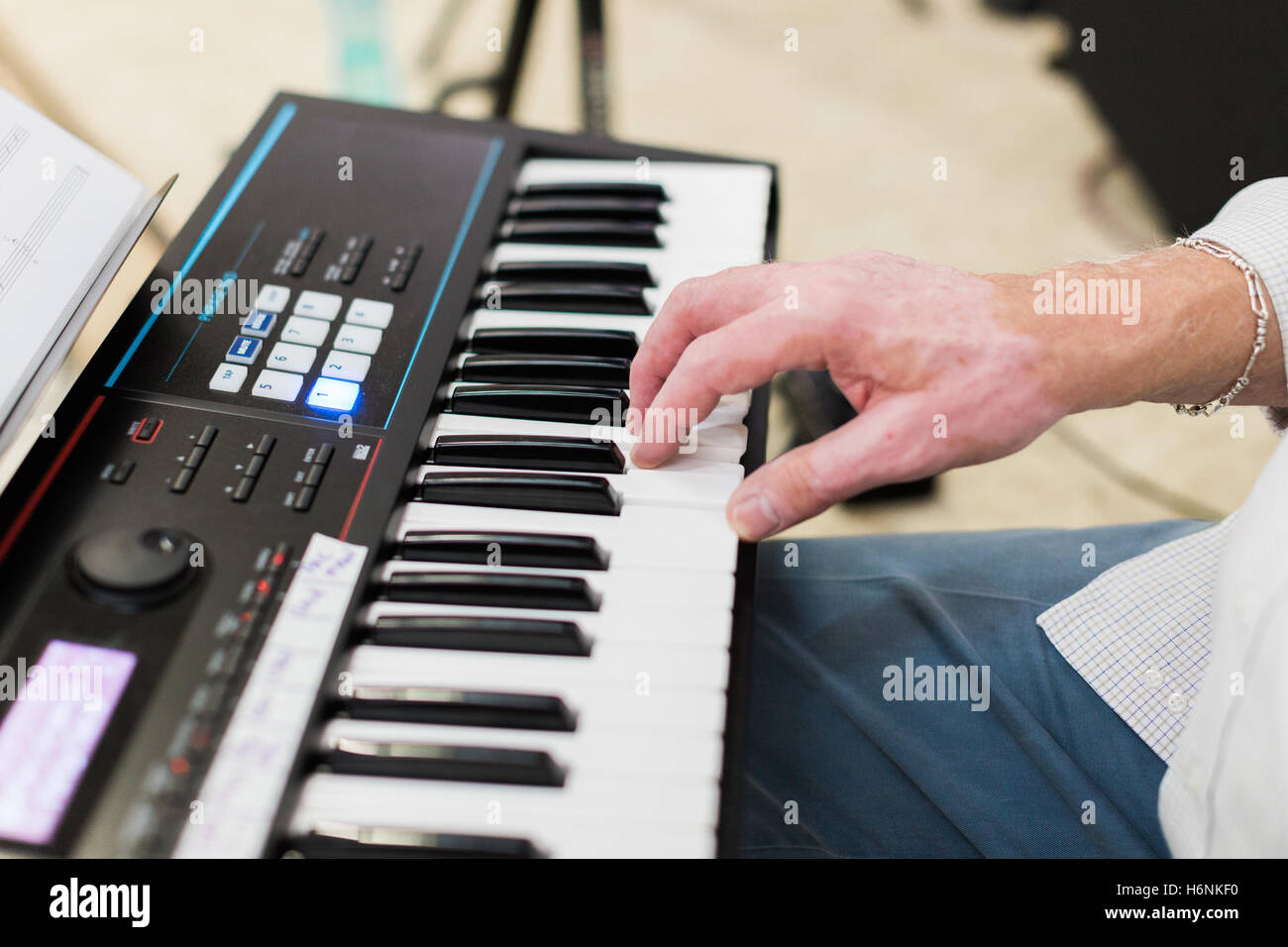 Keyboard player performing on stage live concert Stock Photo - Alamy