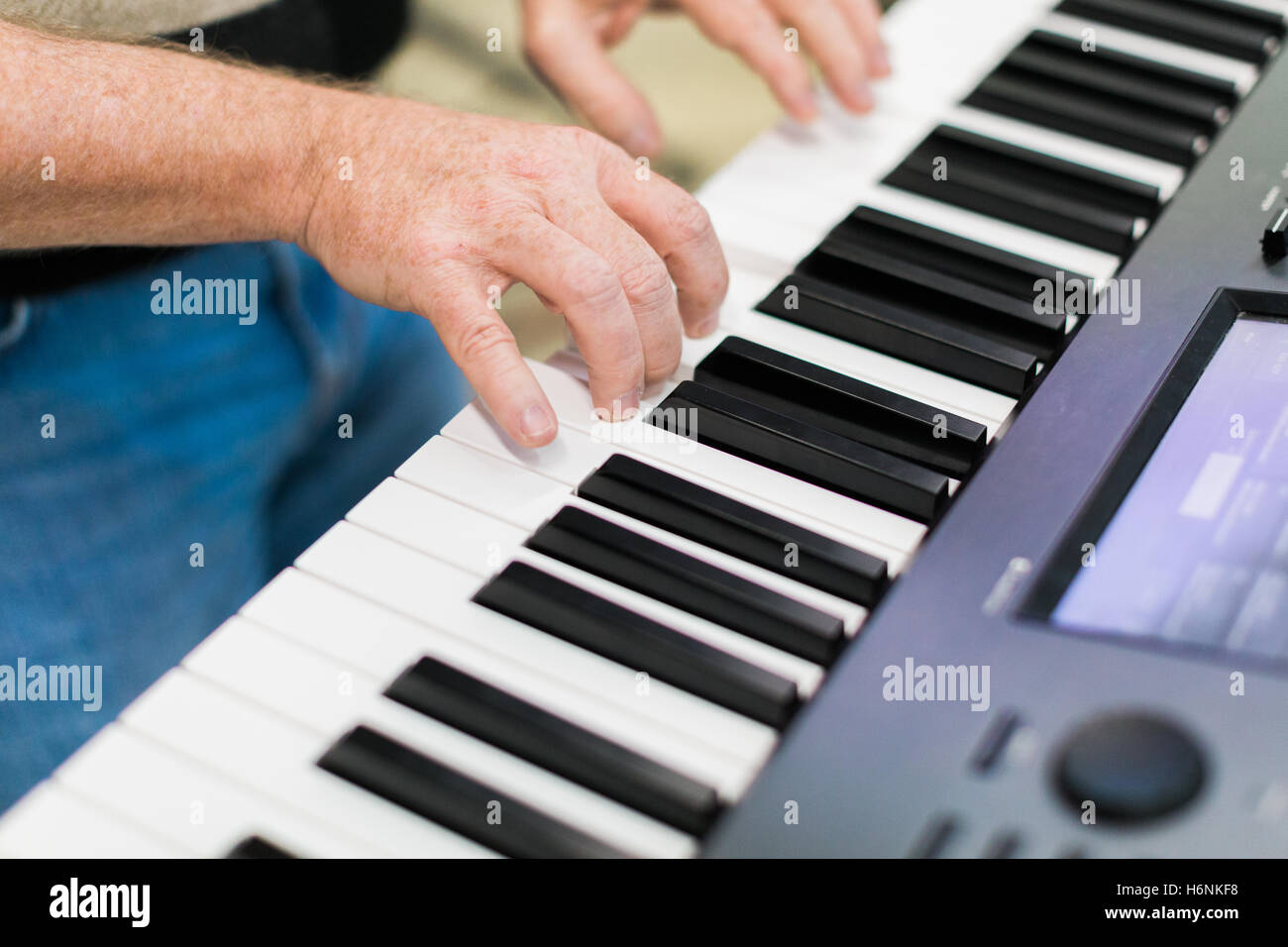 Keyboard player performing on stage live concert Stock Photo - Alamy