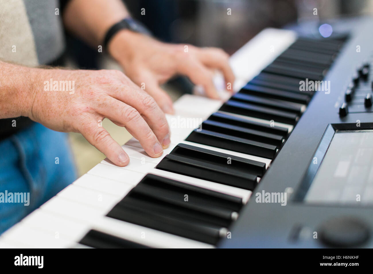 Keyboard player performing on stage live concert Stock Photo - Alamy
