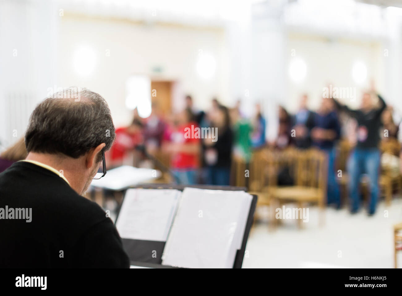 Keyboard player performing on stage live concert in front of people ...