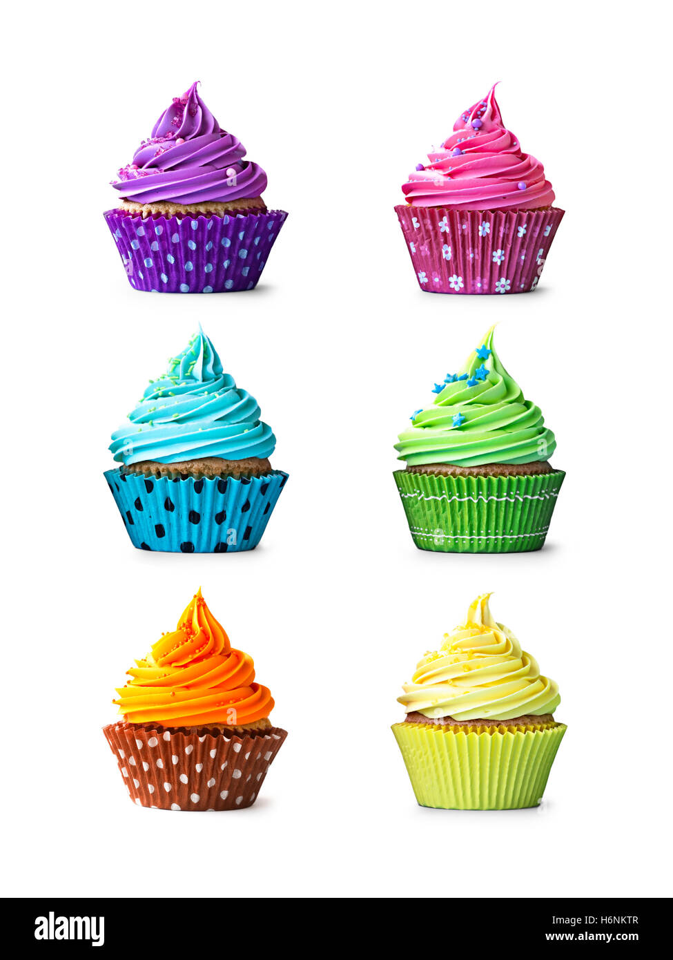 Colorful cupcakes isolated on a white background Stock Photo - Alamy