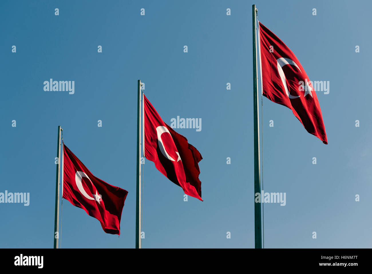 Three Turkish flags waving on the sky by wind Stock Photo - Alamy