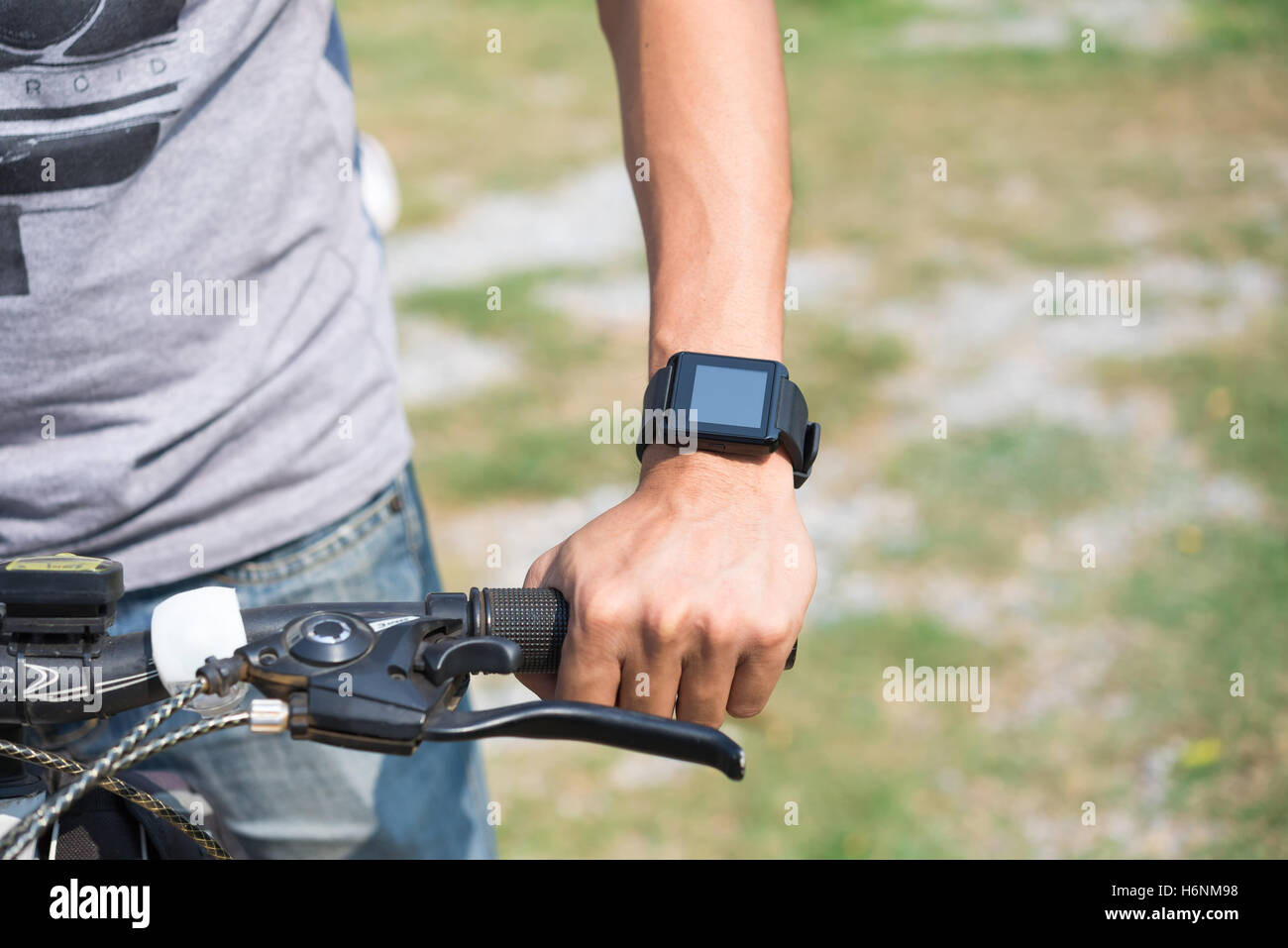 Close-up smart watch on arm women to ride a bicycle Stock Photo - Alamy