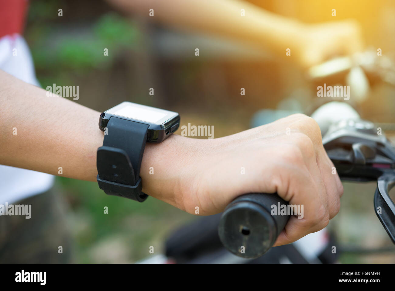 Close-up smart watch on arm women to ride a bicycle Stock Photo - Alamy