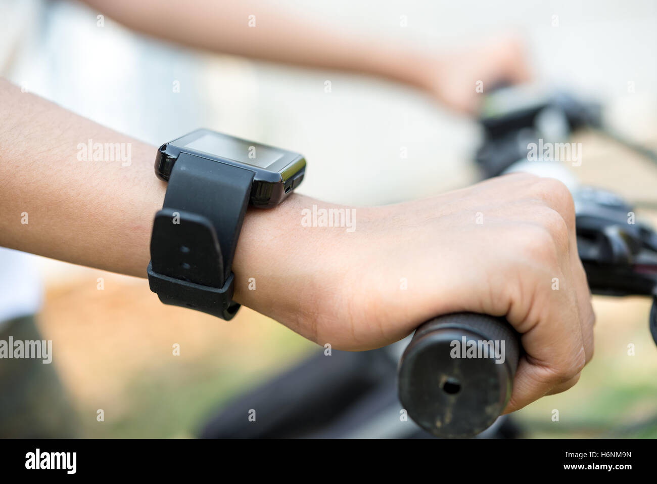 Close-up smart watch on arm women to ride a bicycle Stock Photo - Alamy