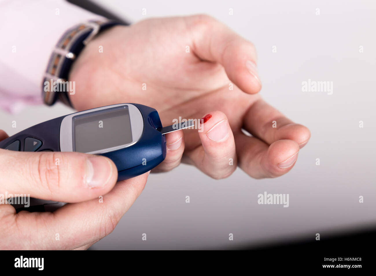 Measuring glucose level blood test using ultra mini glucometer and ...