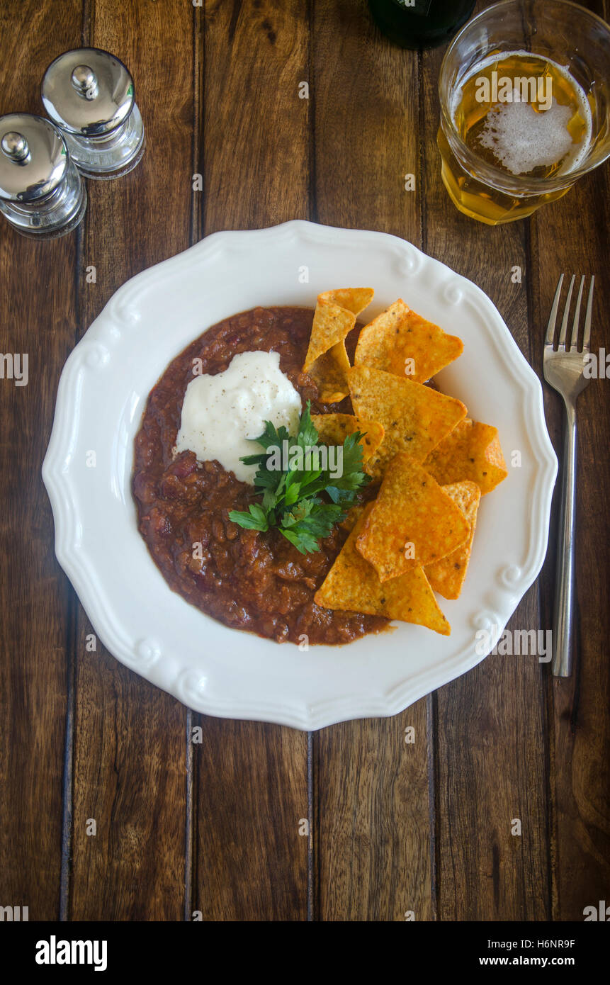 Chilli con carne with tortilla crisps Stock Photo - Alamy