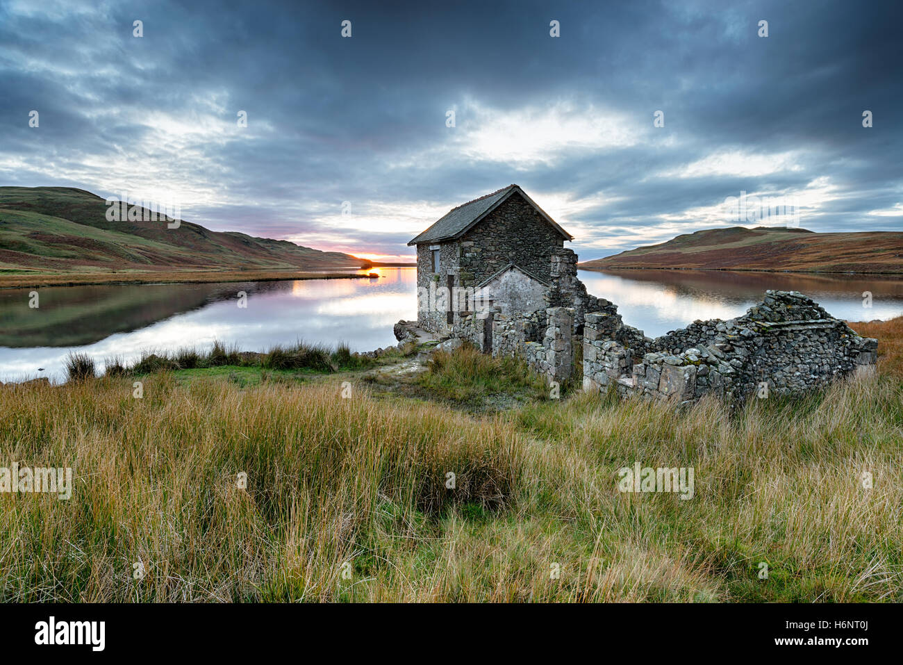 A beautiful old stone boathouse on the shores of Devoke Water on the ...