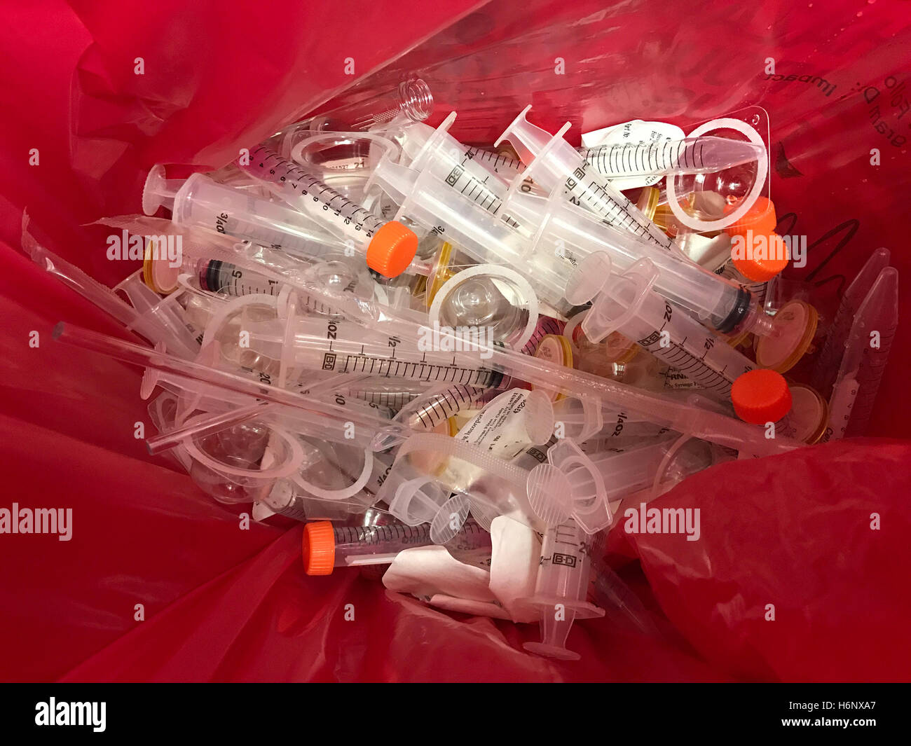 In an HIV laboratory, single-use plastic syringes, pipettes, and ...
