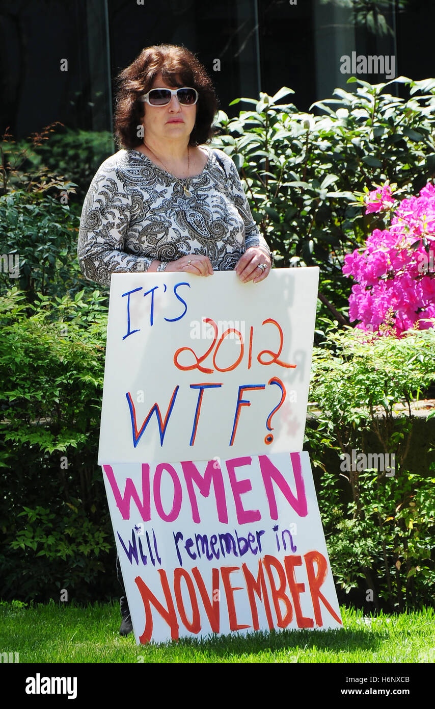 A female activist holds a sign at a pro choice protest at Sacramento ...