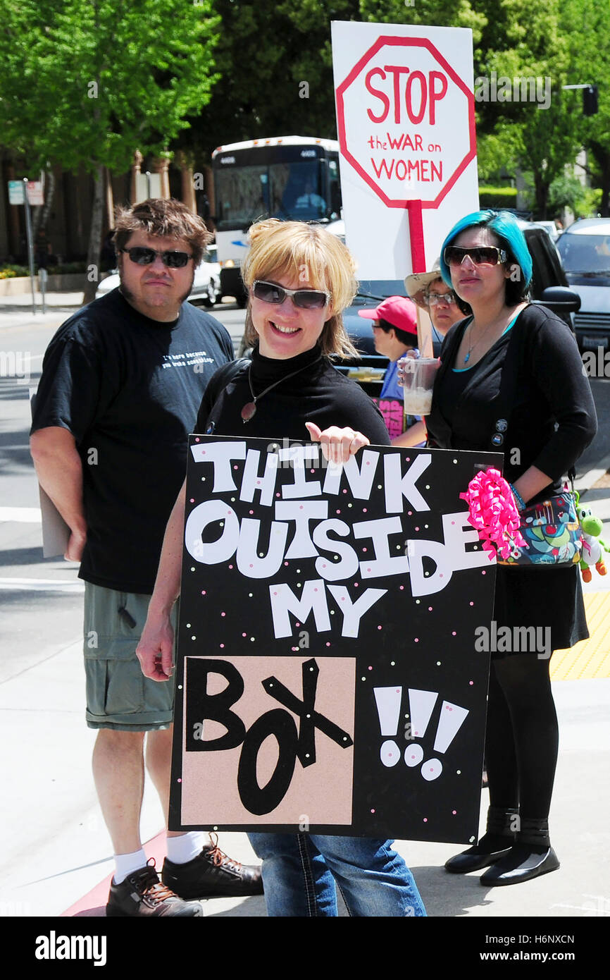 A female activist holds a sign at a pro choice protest at Sacramento ...