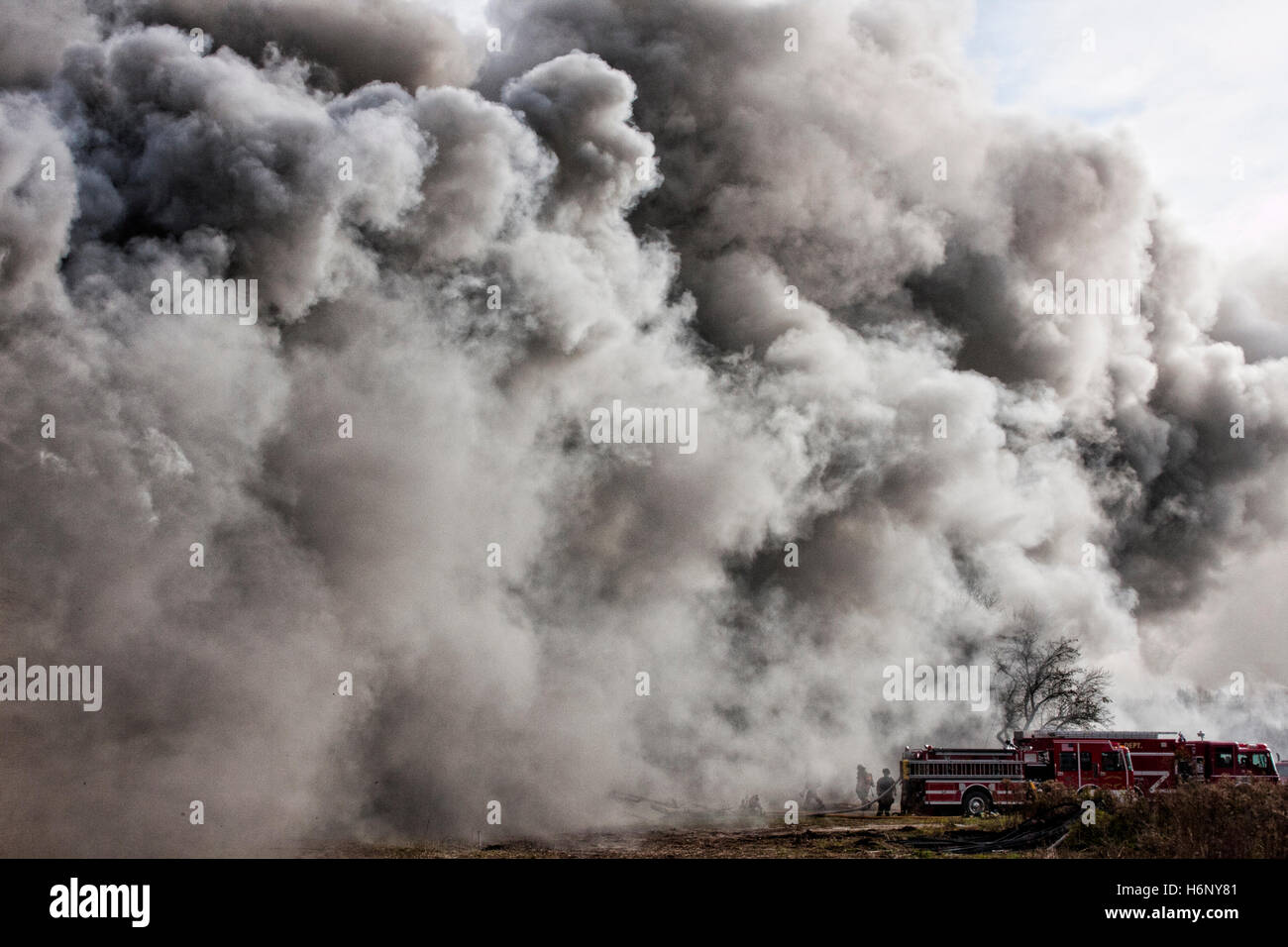 Smoke from a fire in Sussex Wisconsin envelopes the Firefighters and ...