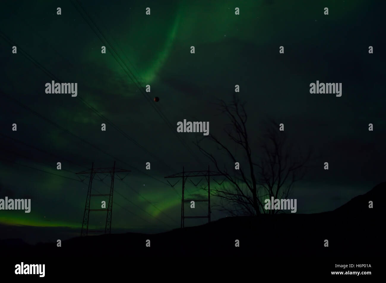 beautiful colorful aurora borealis dancing on night sky over massive ...