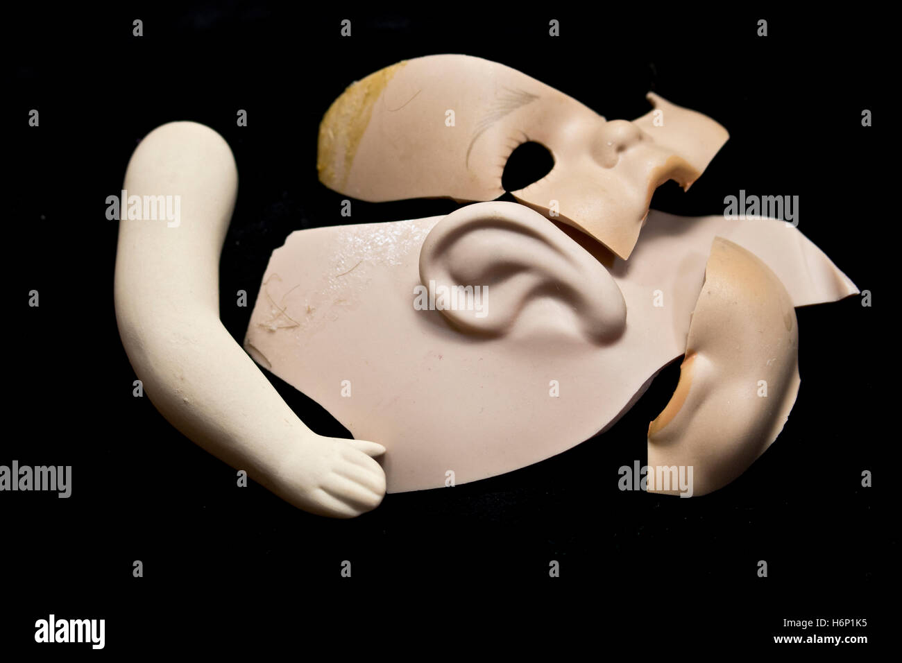 Broken Doll Face and Head on Black Background Stock Photo - Alamy