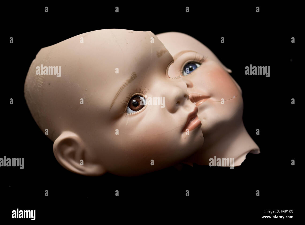Broken Doll Face and Head on Black Background Stock Photo - Alamy