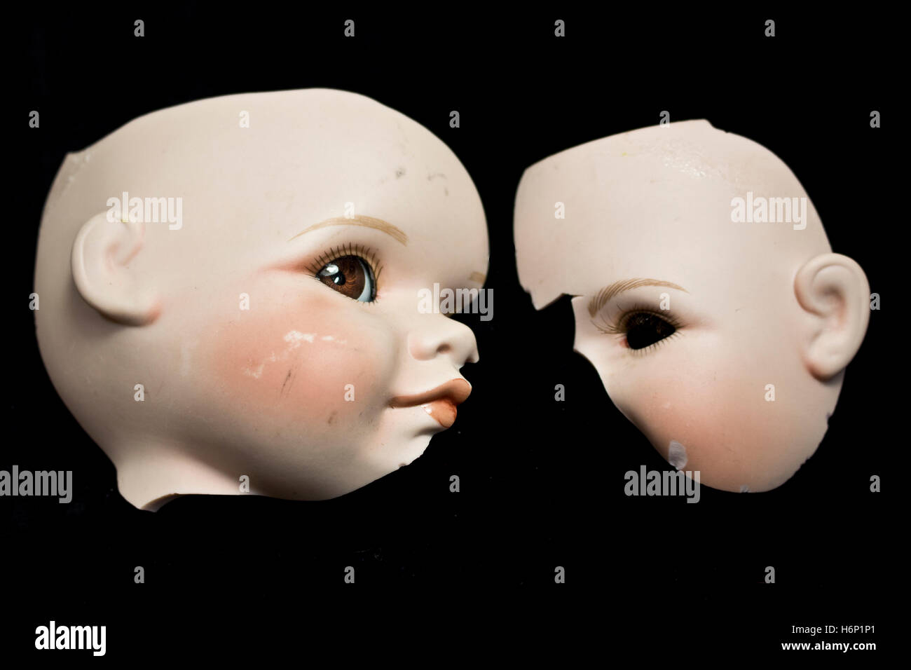 Broken Doll Face and Head on Black Background Stock Photo - Alamy