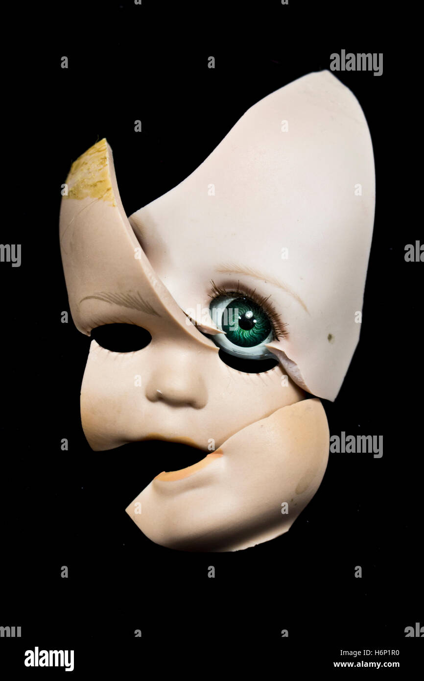 Broken Doll Face and Head on Black Background Stock Photo - Alamy