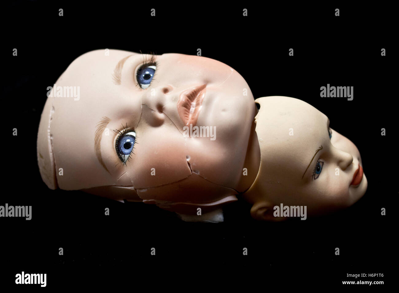 Broken Doll Face and Head on Black Background Stock Photo - Alamy