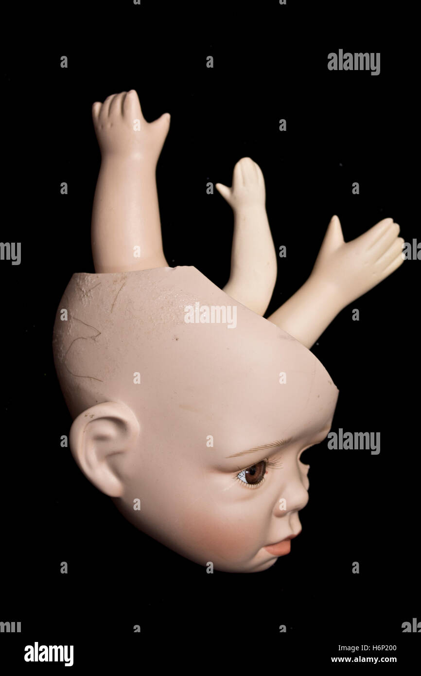 Broken Doll Face and Head on Black Background Stock Photo - Alamy