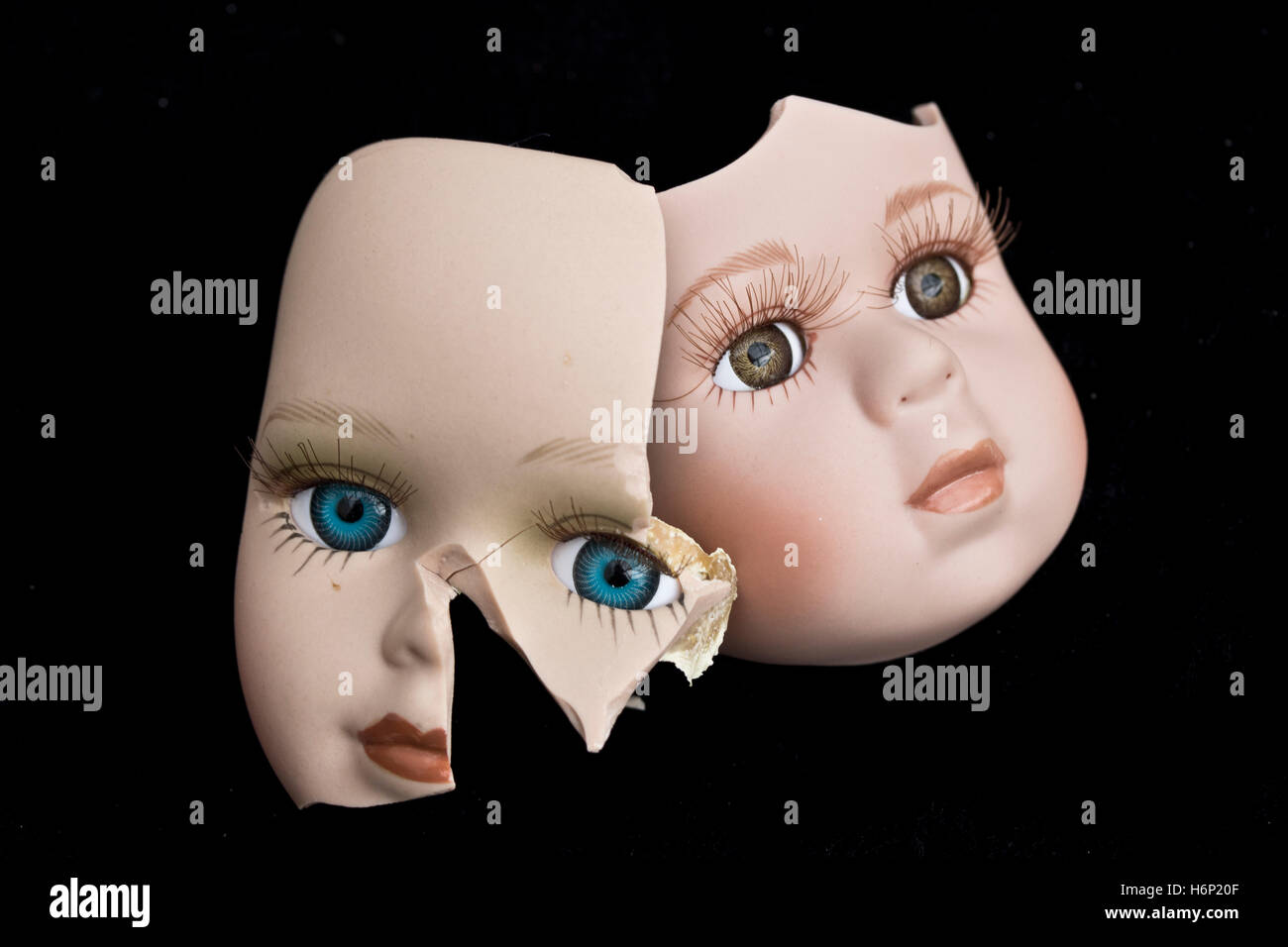 Broken Doll Face and Head on Black Background Stock Photo - Alamy