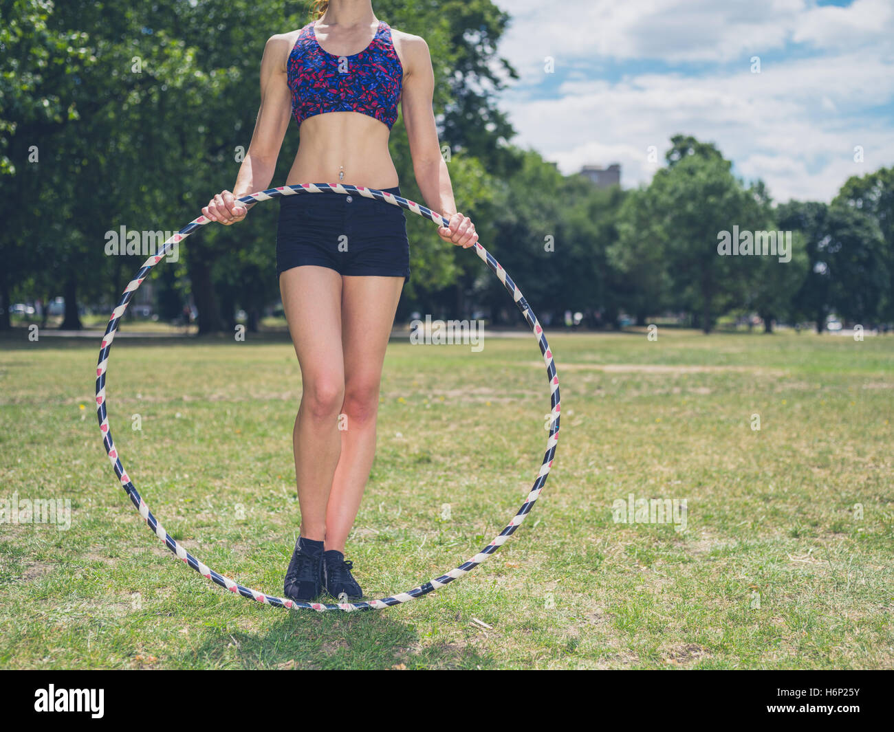 Female hula hoop grass hi-res stock photography and images - Alamy