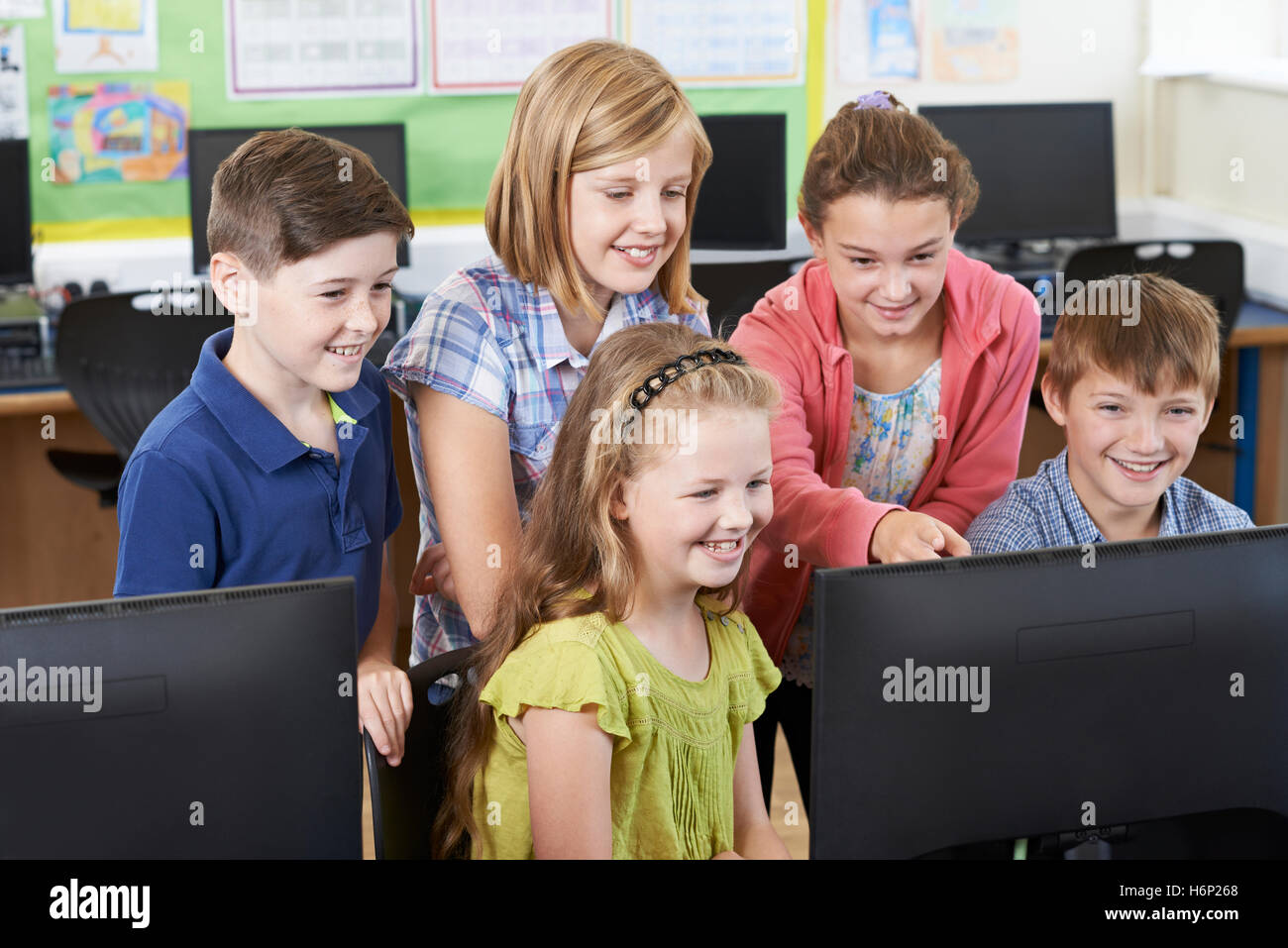 Group Of Elementary School Pupils In Computer Class Stock Photo - Alamy
