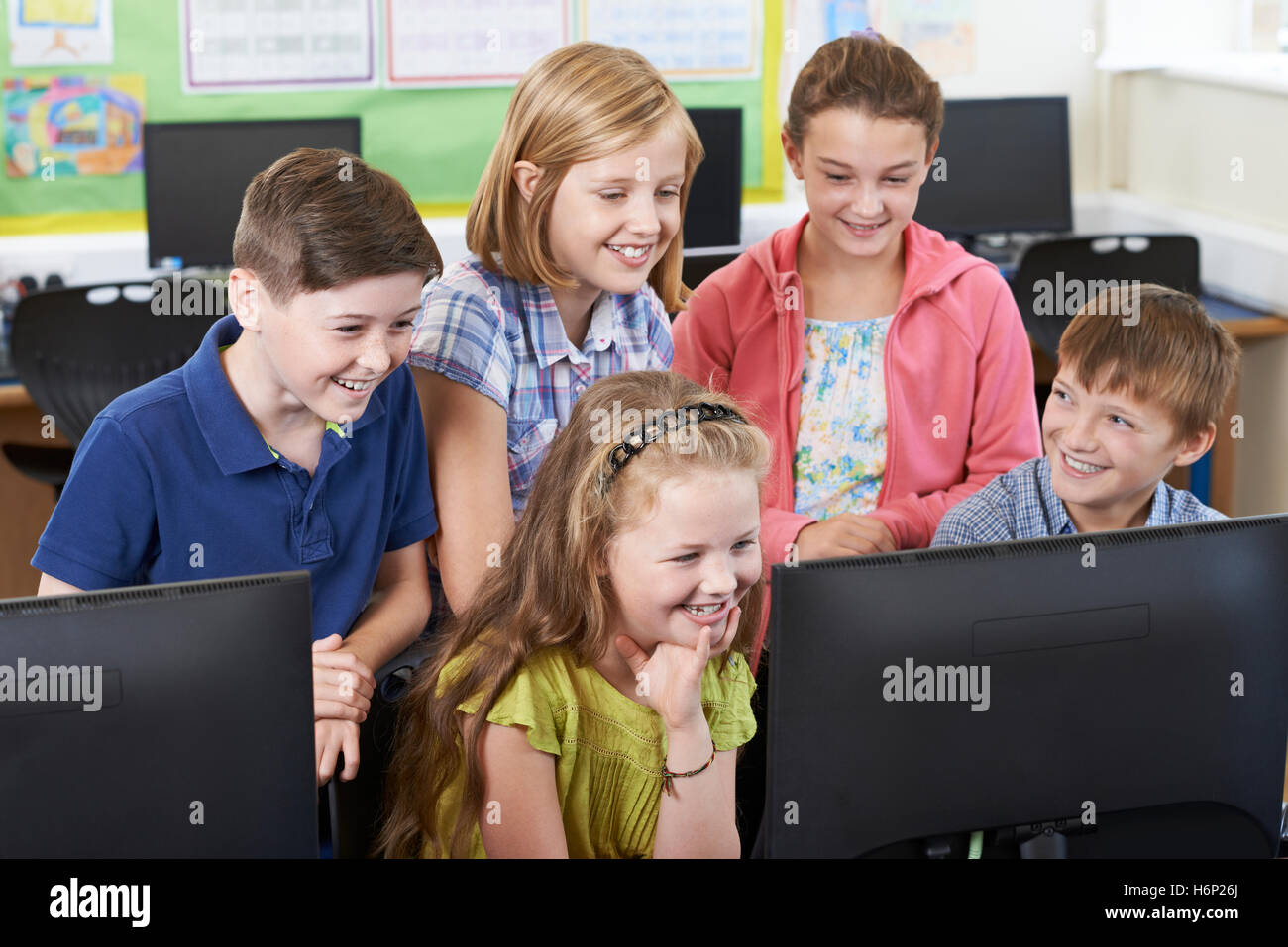 Group Of Elementary School Pupils In Computer Class Stock Photo - Alamy