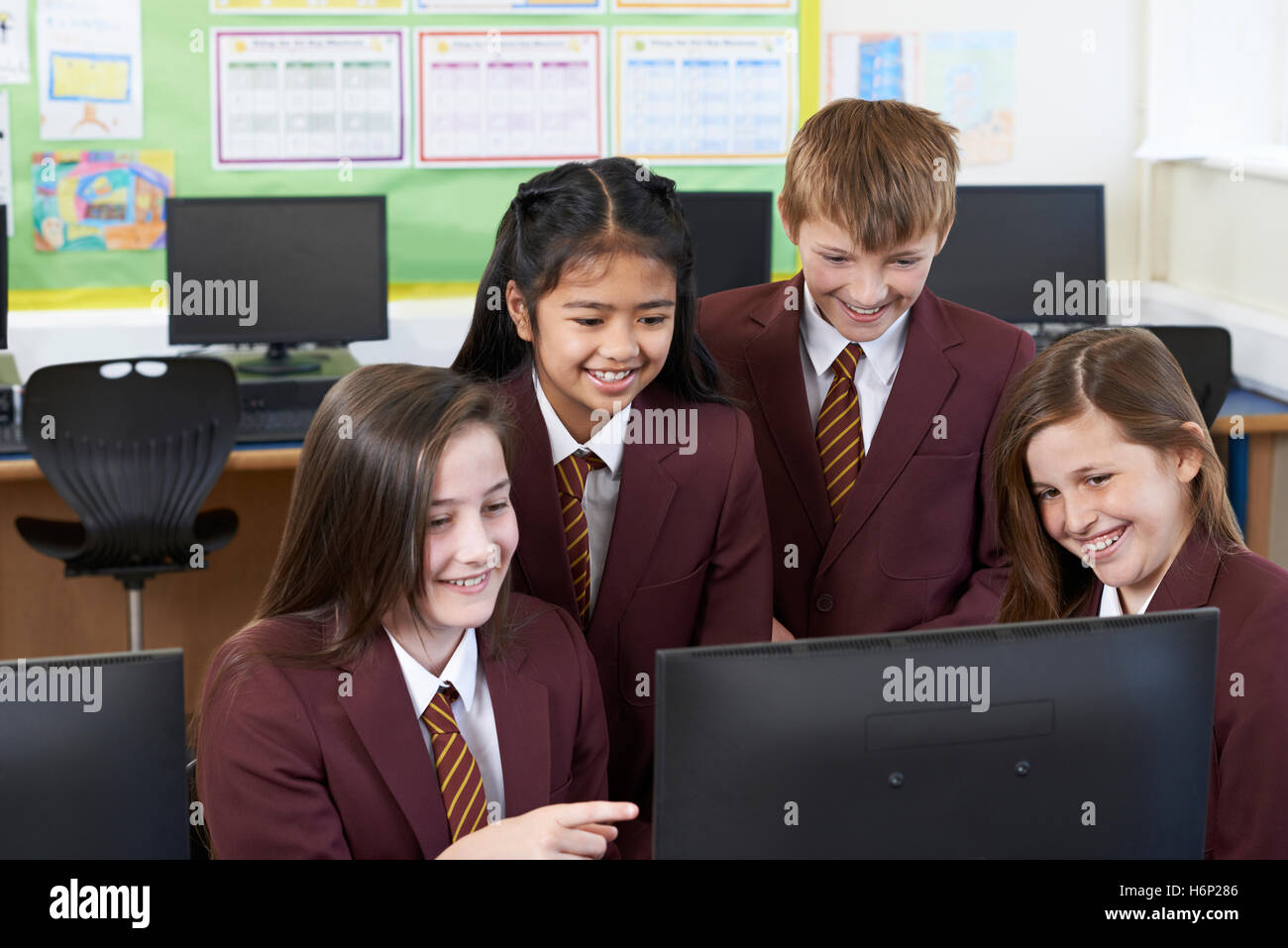 Portrait Of Elementary School Pupils In Computer Class Stock Photo - Alamy