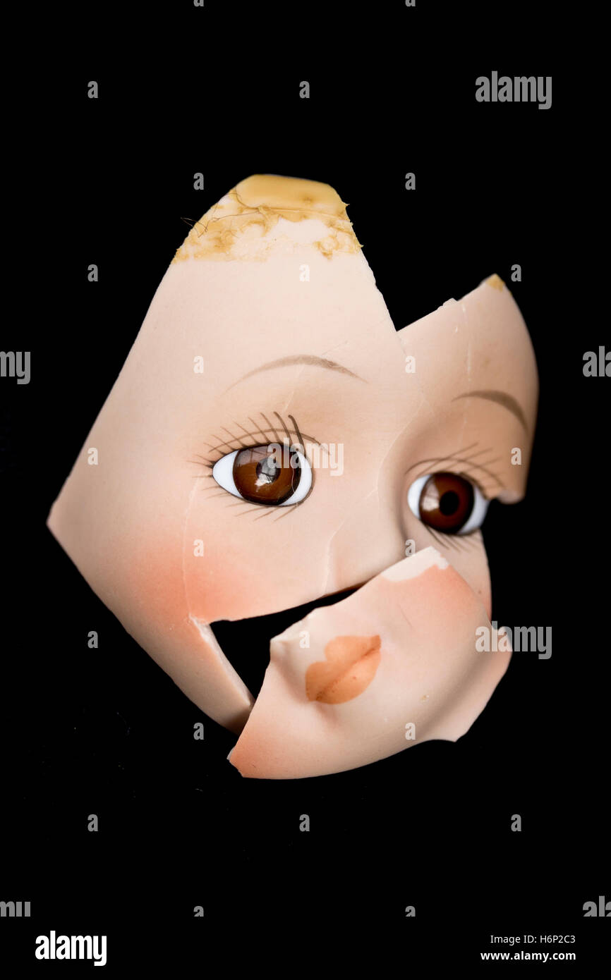 Broken Doll Face and Head on Black Background Stock Photo - Alamy