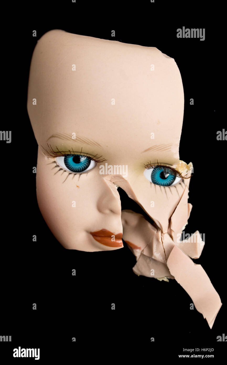 Broken Doll Face and Head on Black Background Stock Photo - Alamy