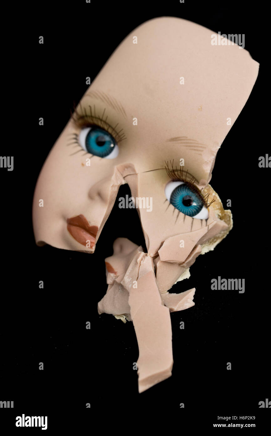 Broken Doll Face and Head on Black Background Stock Photo - Alamy