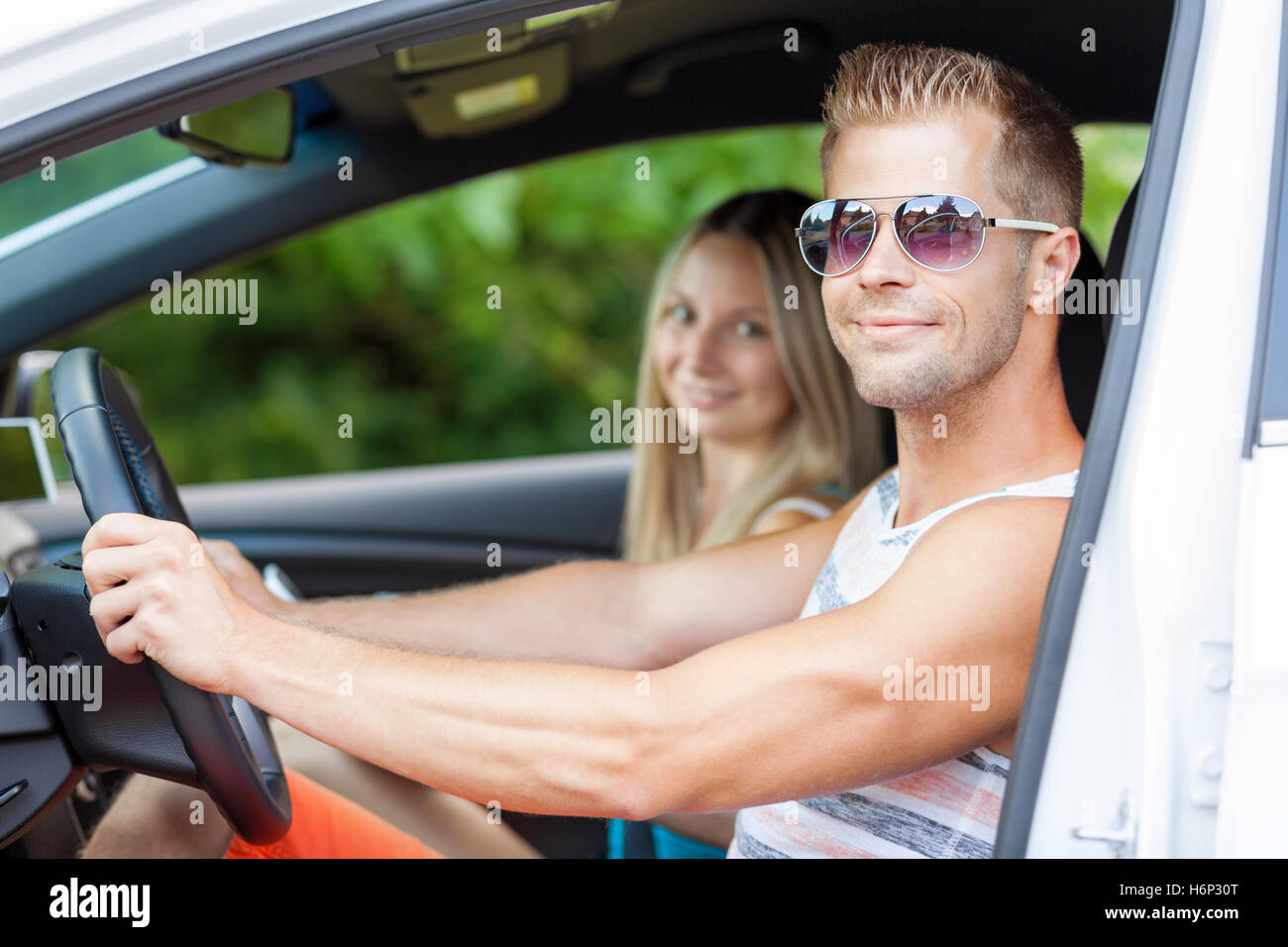 Young happy people enjoying a roadtrip in the car Stock Photo - Alamy