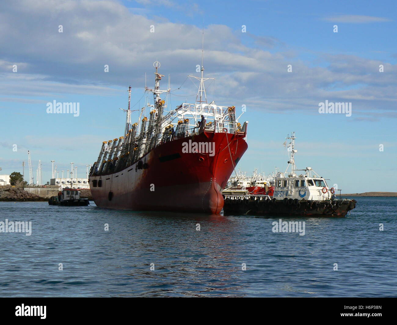 ship and tug at work Stock Photo - Alamy